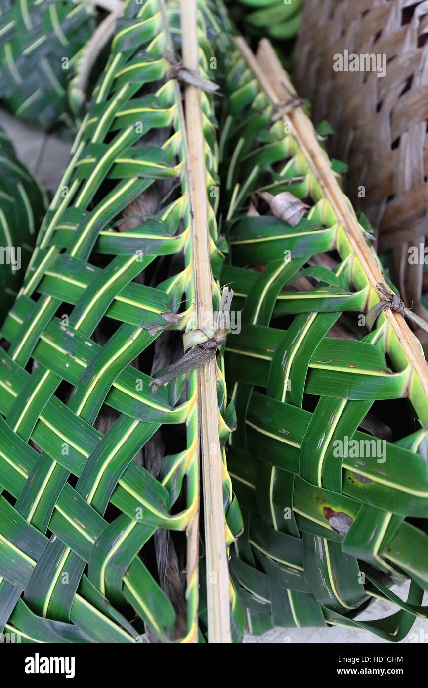 Traditional baskets made of braided coconut leaf for the transportation ...