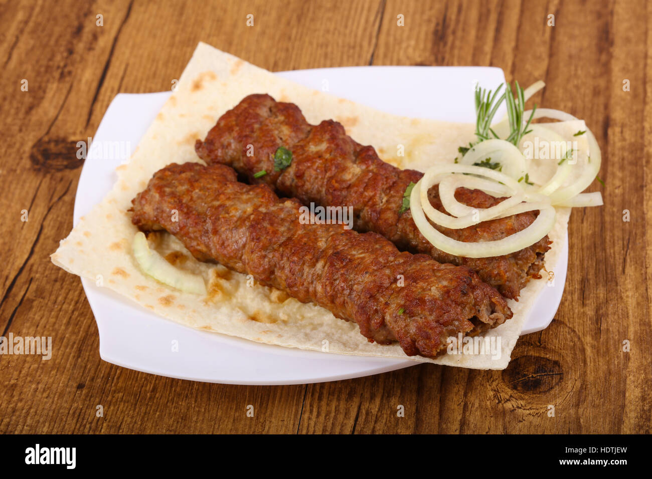 Hot Juicy Grilled Kebab with onion and parsley Stock Photo - Alamy
