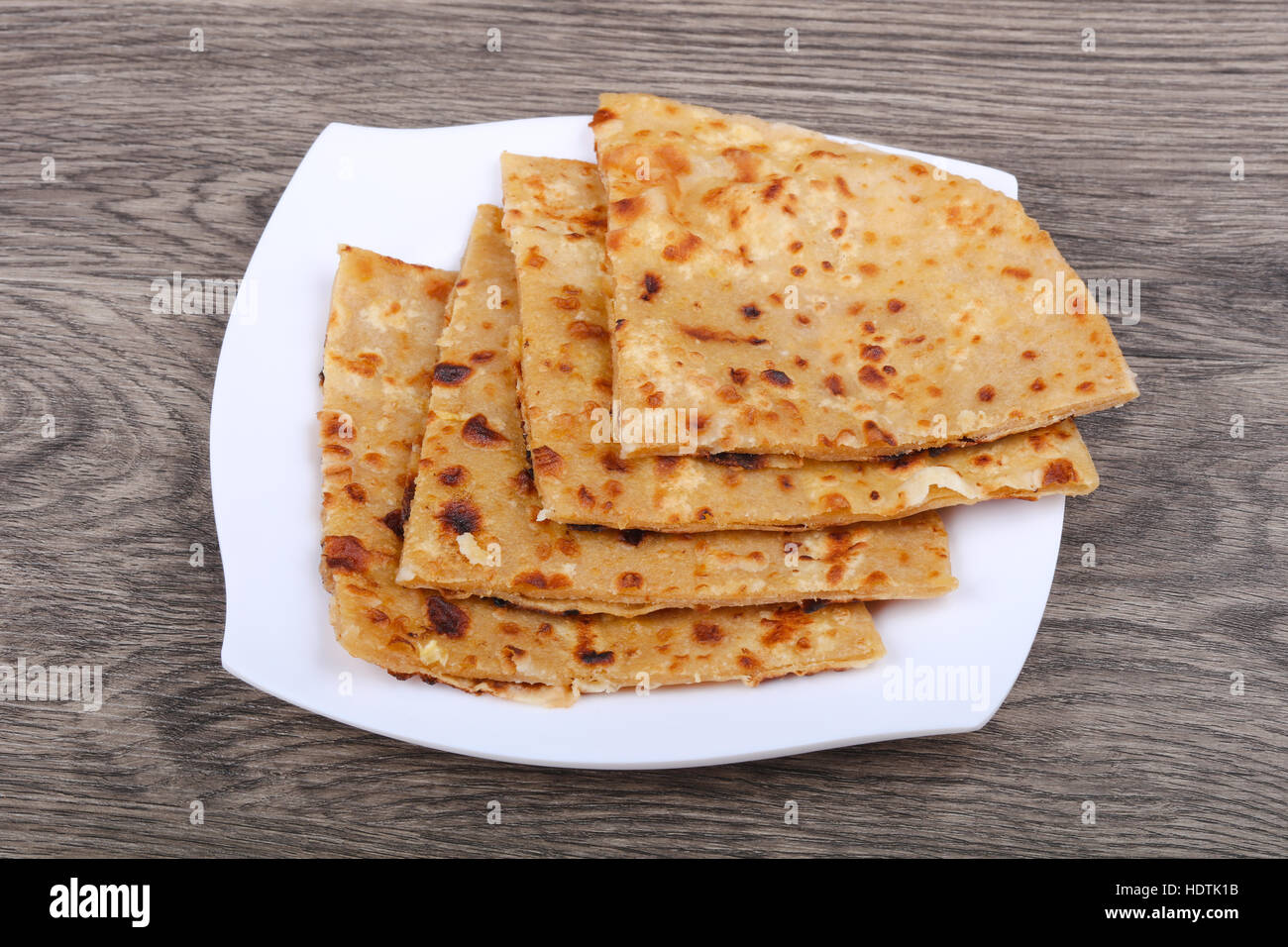 Indian bread roti on the plate in wood background Stock Photo - Alamy