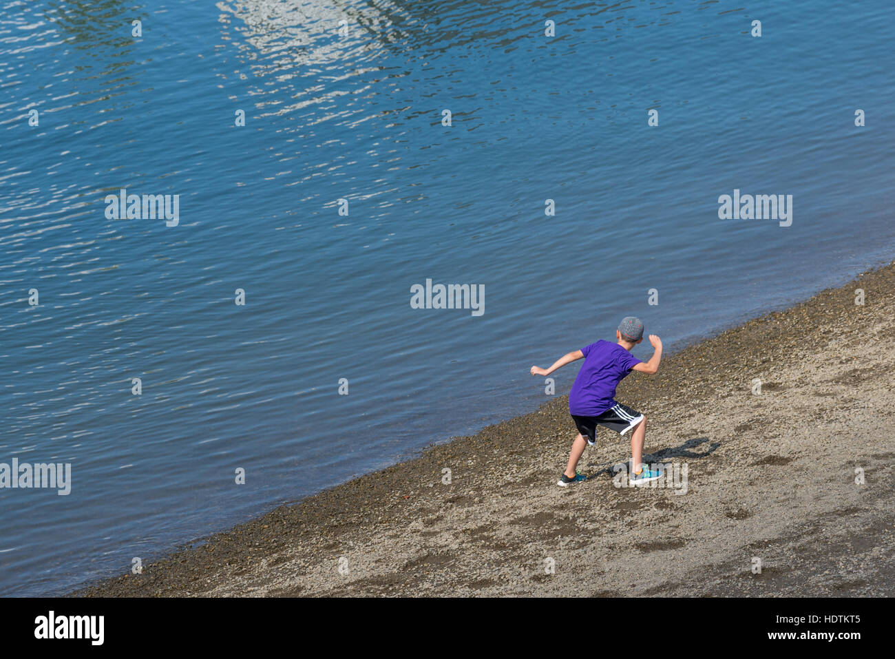 Kid throwing rock hi-res stock photography and images - Alamy