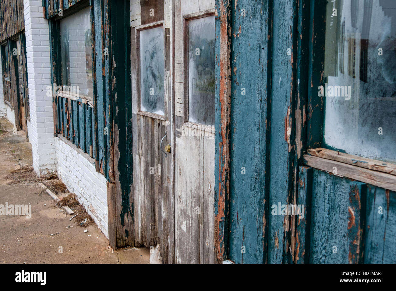 Abandoned empty deteriorating old derelict building in disrepair in ...