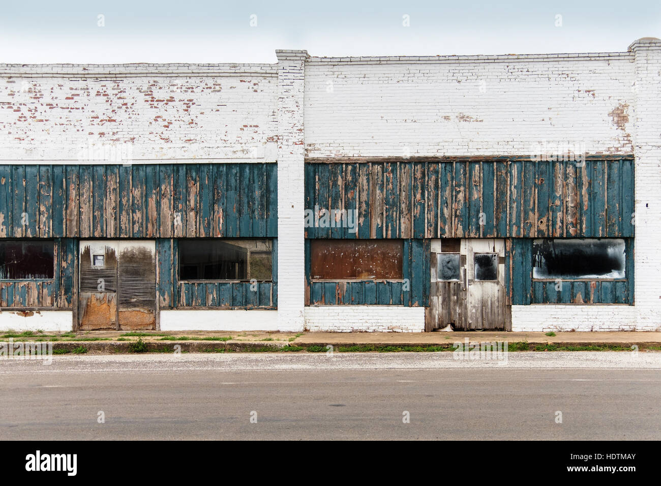 Abandoned empty deteriorating old derelict building in disrepair in ...