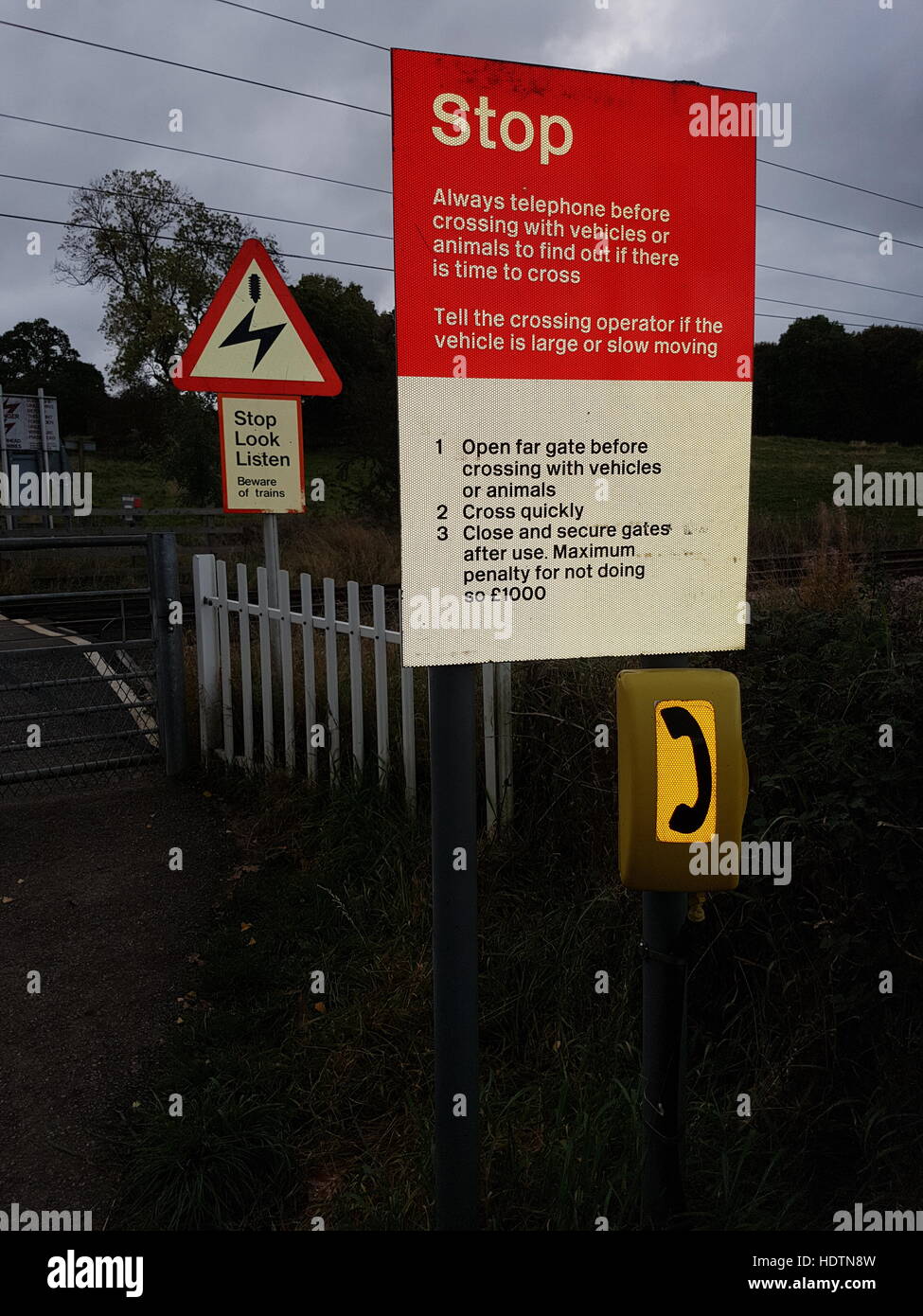 Emergency phone at unmanned level crossing Stock Photo - Alamy