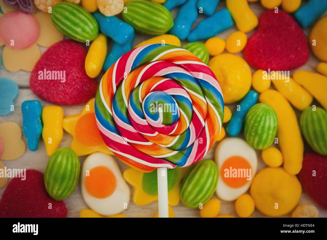 Round lollipop and many candies with different shapes and colors Stock ...