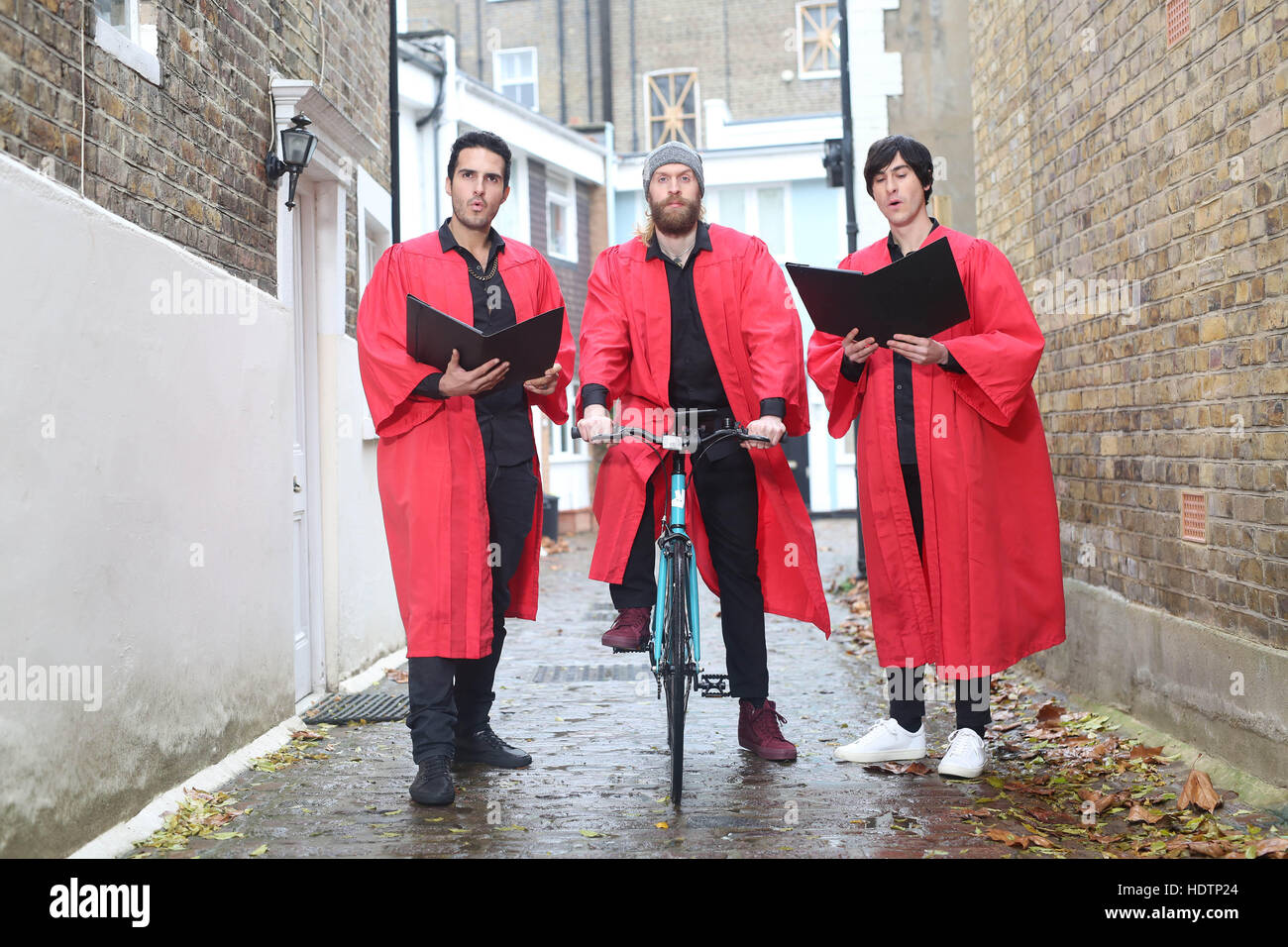 EDITORIAL USE ONLY Beatboxing carollers (left to right) Christian ...