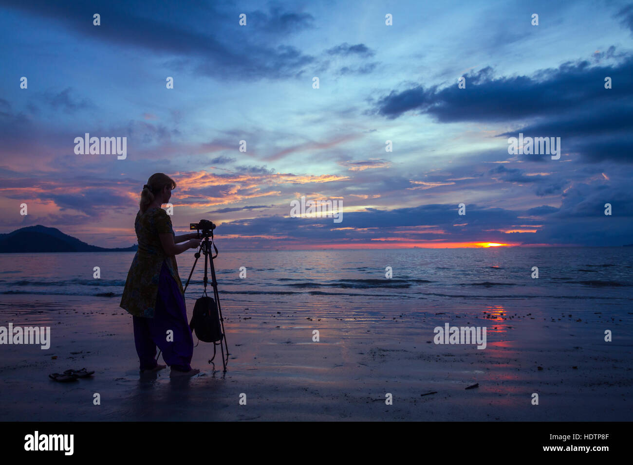 Photographer in sunset in Koh Muk beach, Thailand Stock Photo - Alamy