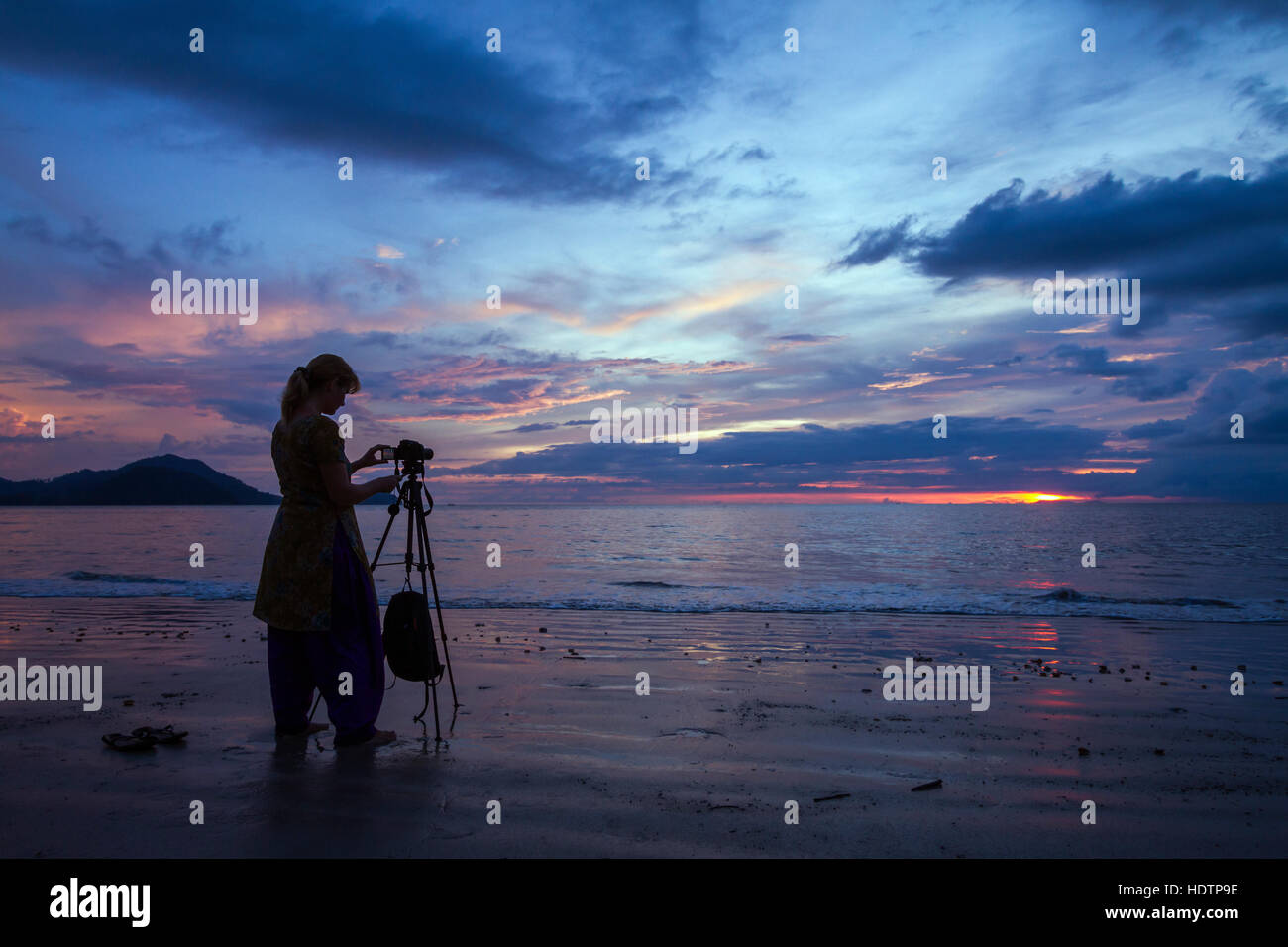 Photographer in sunset in Koh Muk beach, Thailand Stock Photo - Alamy