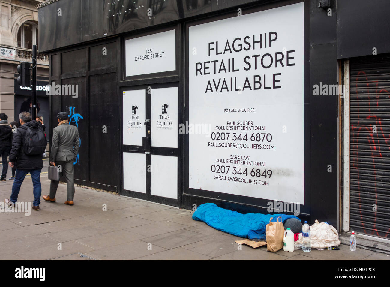 Homeless person sleeping outside an empty retail unit on Oxford Street ...