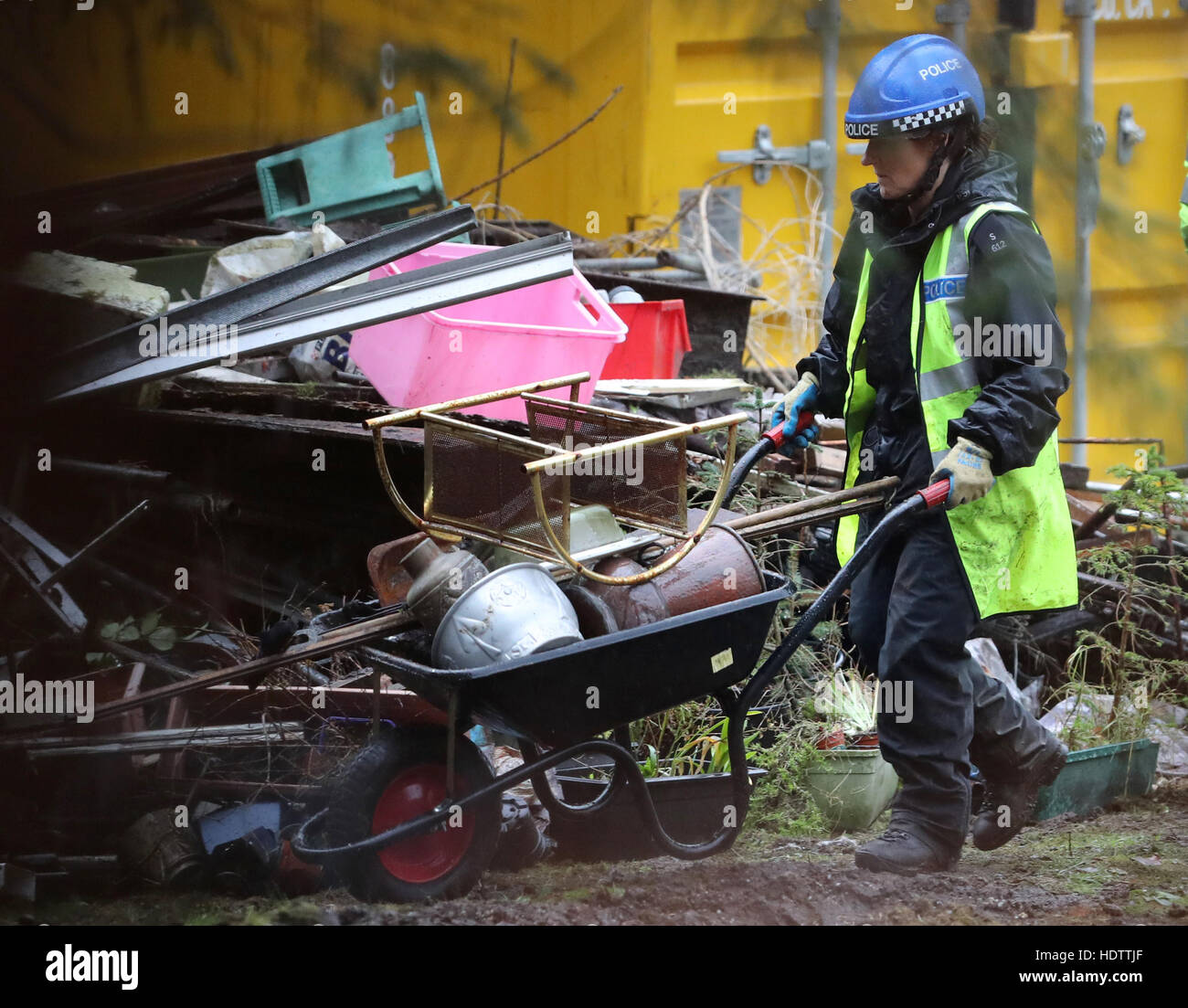 Police remove contents as they search a cottage and its grounds where ...