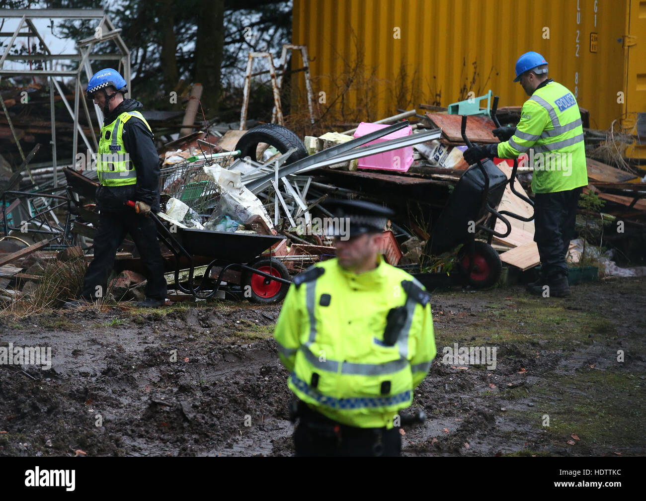 Police remove contents as they search a cottage and its grounds where ...