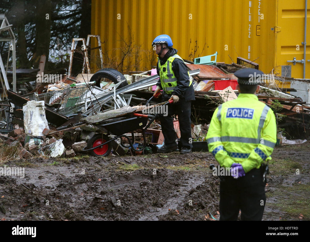 Police remove contents as they search a cottage and its grounds where ...