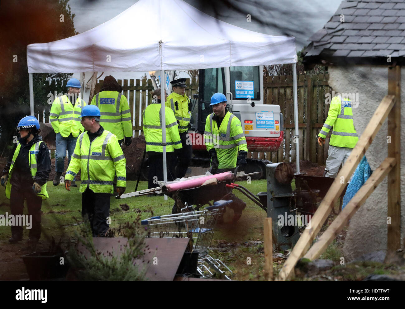 Police remove contents as they search a cottage and its grounds where ...