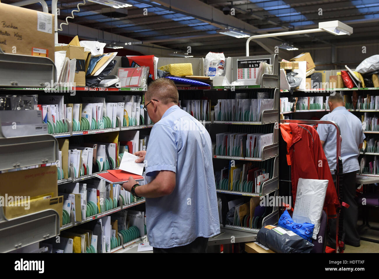 An employee sorts mail nottingham mail centre will process more hi-res ...