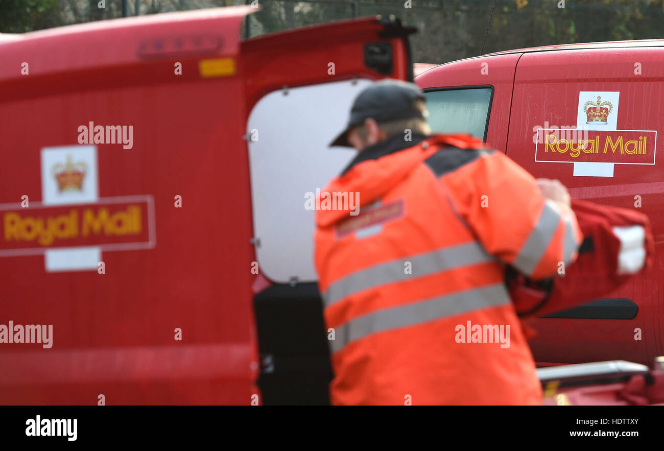 A postman loads his van at Nottingham Mail Centre which will process ...