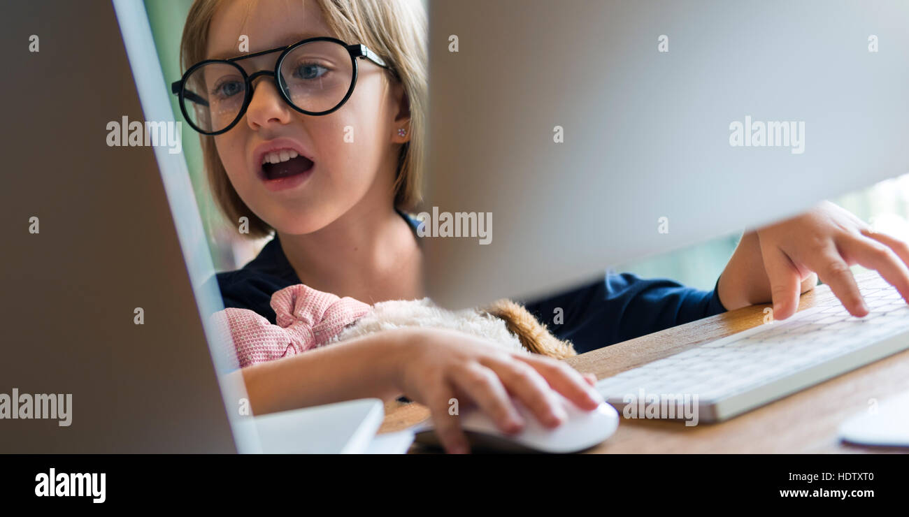 Little Girl Using Device Concept Stock Photo - Alamy