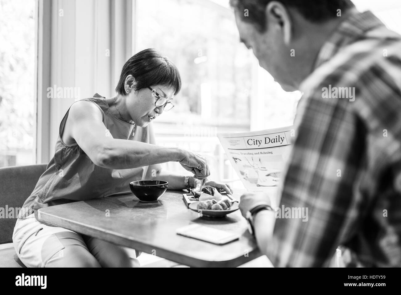Couple old people sitting Black and White Stock Photos & Images - Alamy