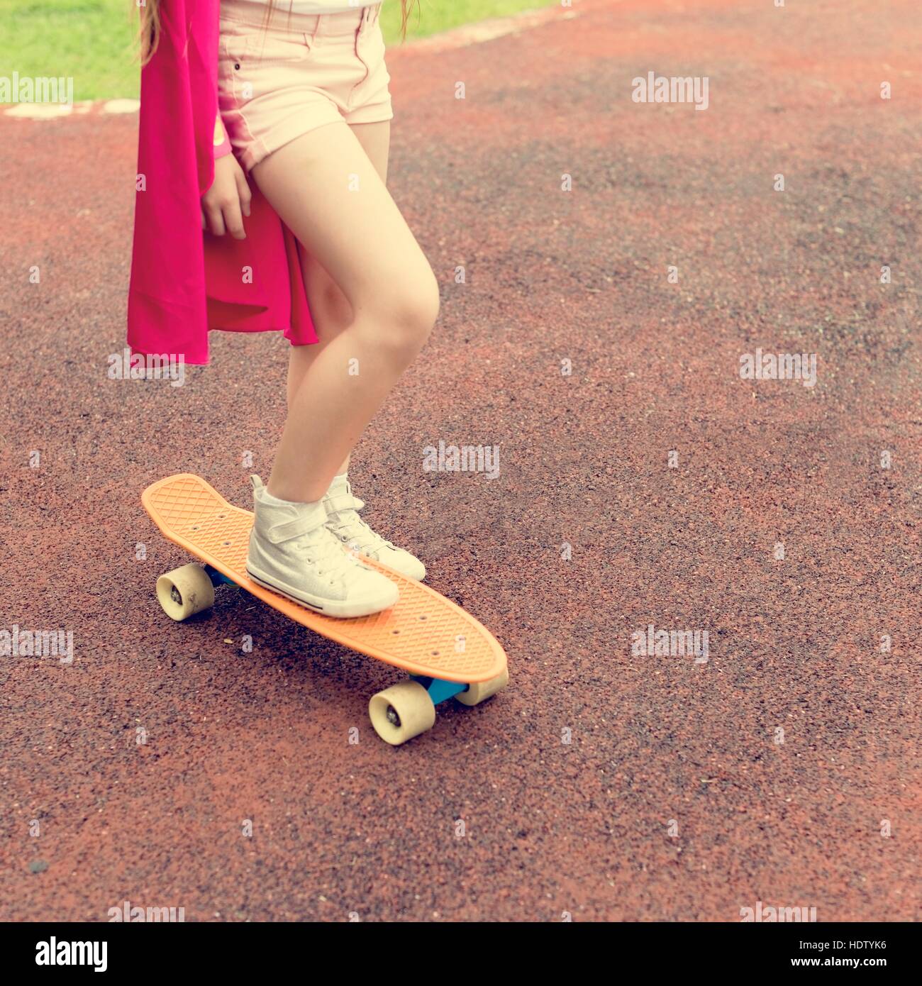 Superhero Girl Playing Skateboard Activity Concept Stock Photo - Alamy