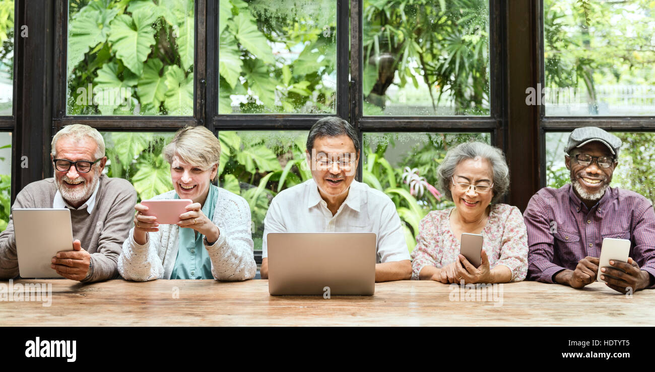 Diverse older people using technology hi-res stock photography and ...