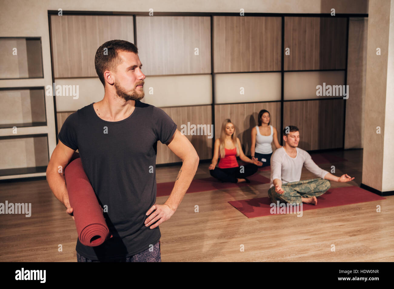 man holds mat in his hands Stock Photo - Alamy