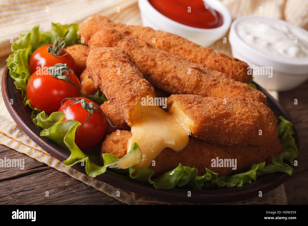 Hot fried cheese close-up on a plate, horizontal Stock Photo - Alamy