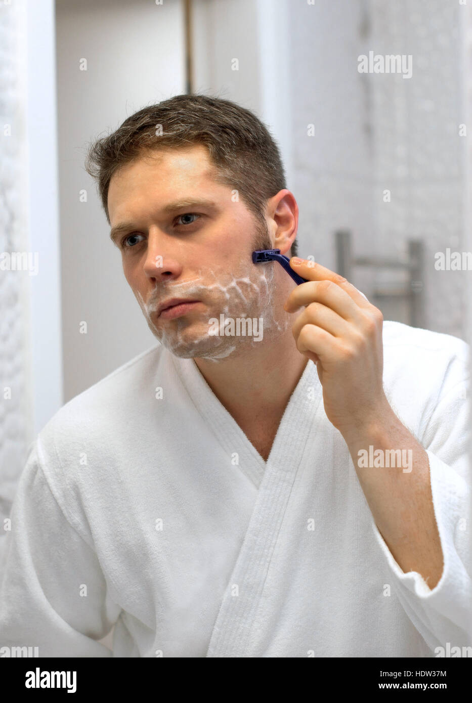 Handsome man shaving disposable hi-res stock photography and images - Alamy