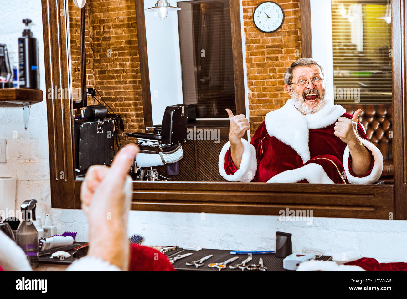 Santa claus shaving his personal barber Stock Photo - Alamy