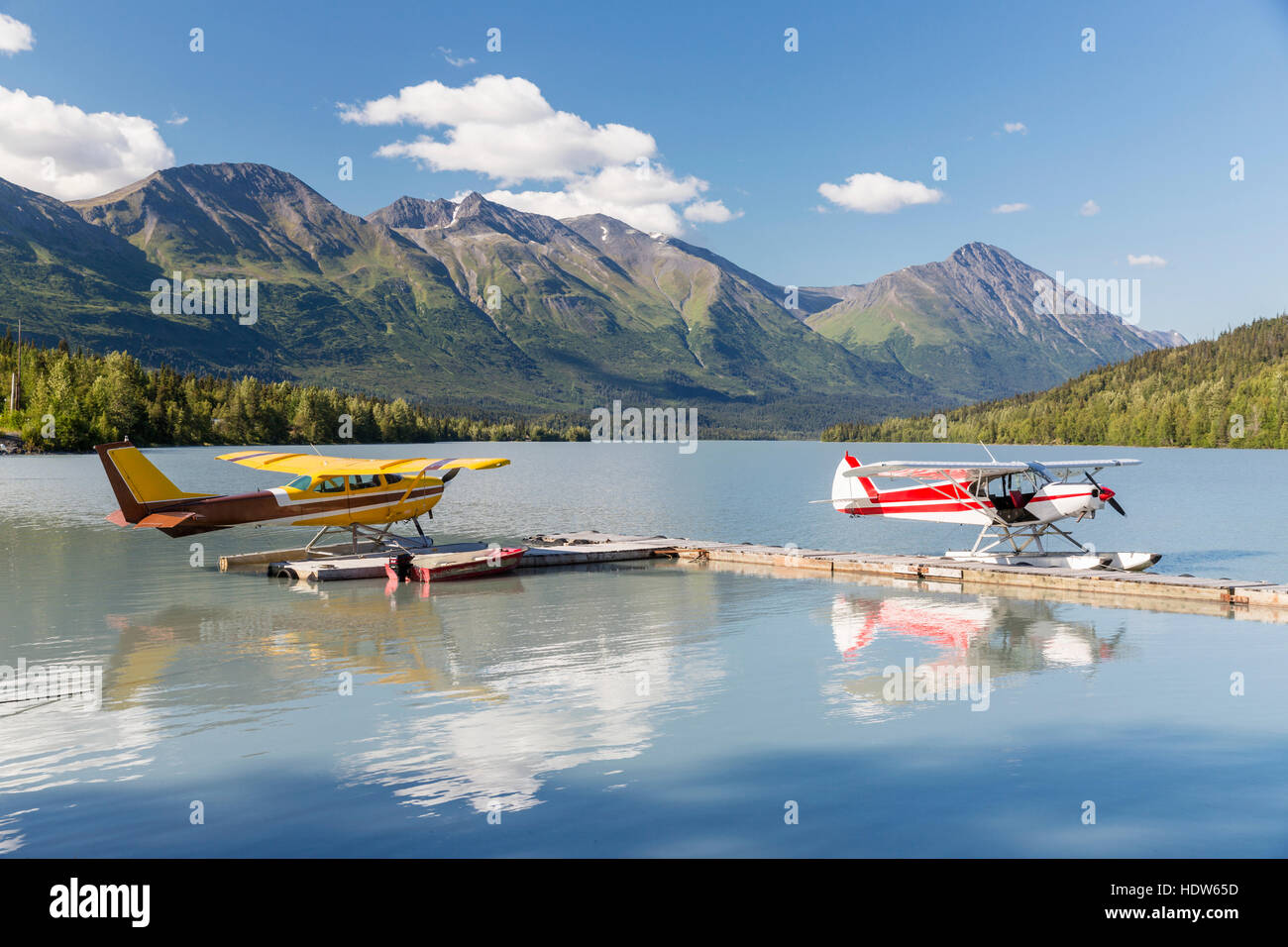 Two Float Planes Docked At The Trail Lake Float Plane Base On A Clear ...