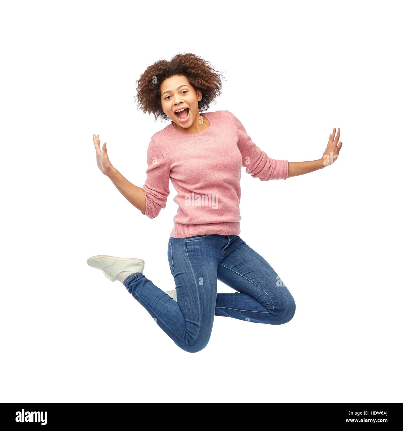 happy african american woman jumping over white Stock Photo - Alamy