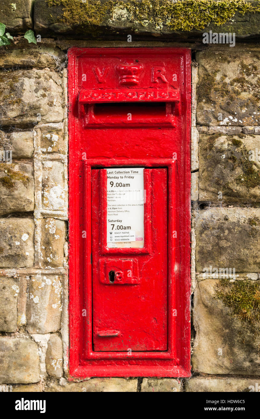 Iconic and traditional Victorian era red letter Royal Mail postbox post ...