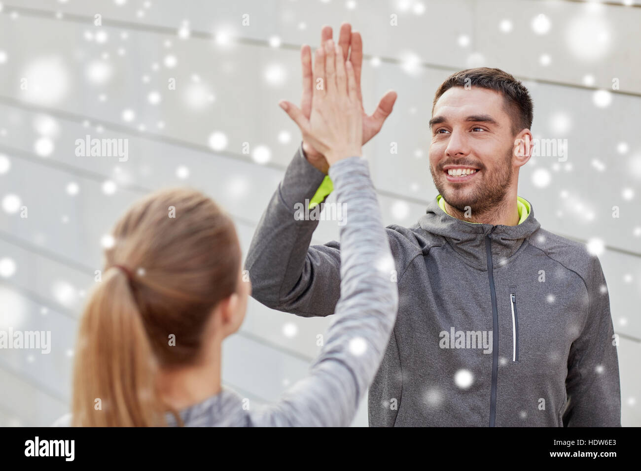 happy couple giving high five outdoors Stock Photo - Alamy