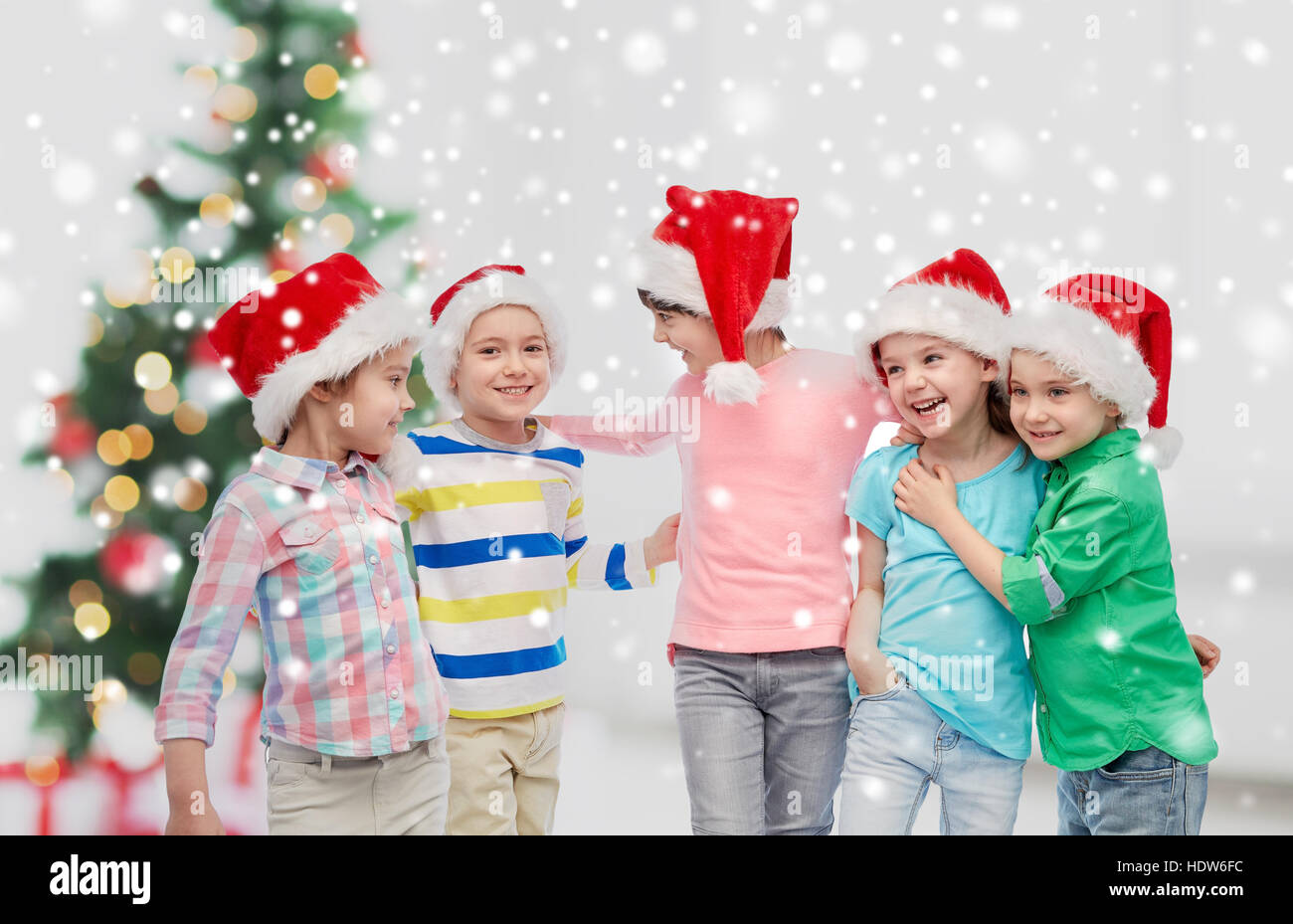 happy little children in christmas santa hats Stock Photo - Alamy