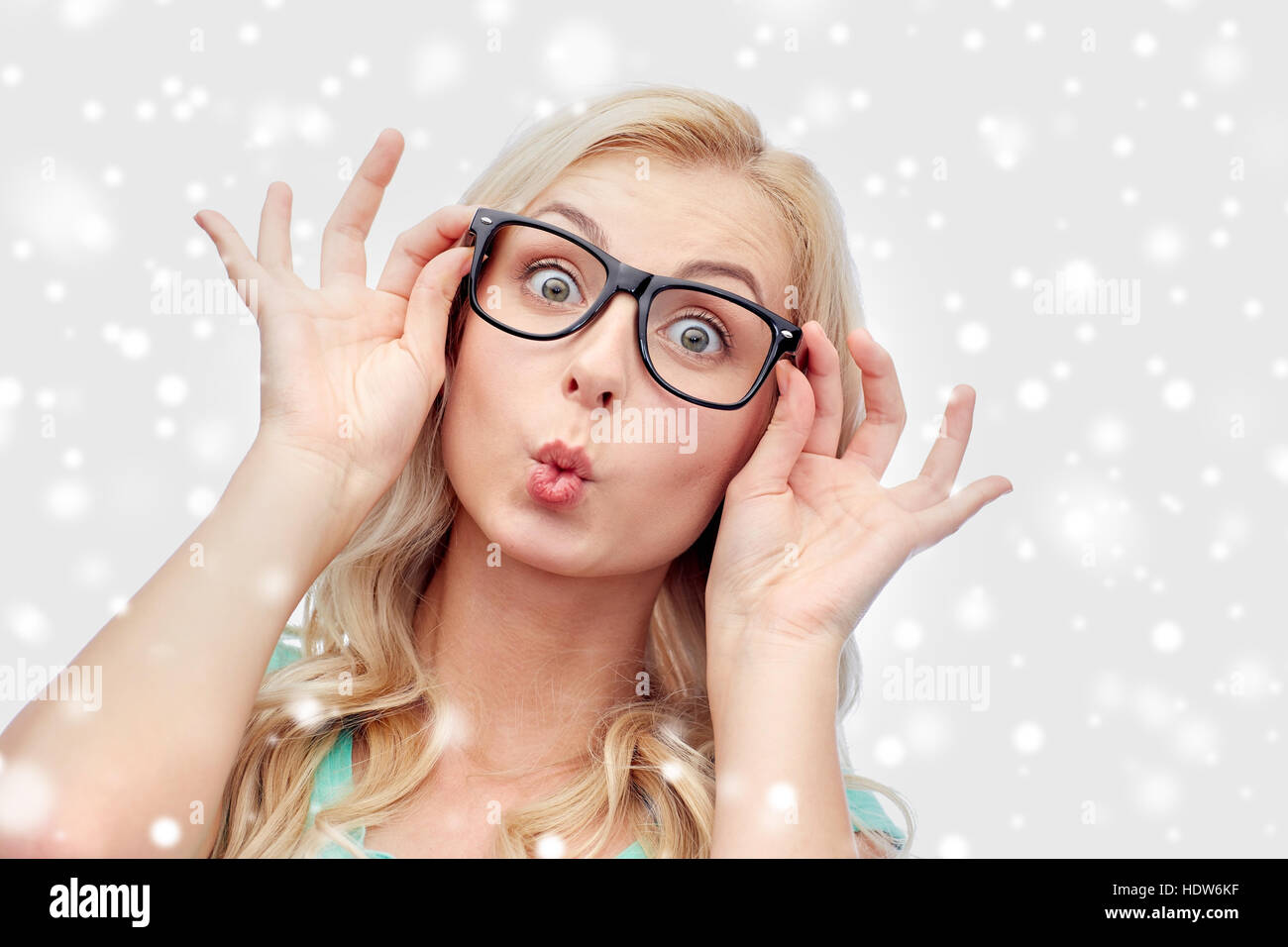 happy young woman in glasses making fish face Stock Photo - Alamy