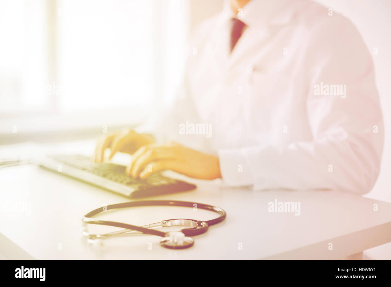 Doctor typing on computer hospital hi-res stock photography and images ...