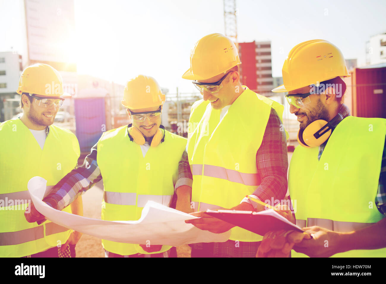 group of builders with tablet pc and blueprint Stock Photo - Alamy