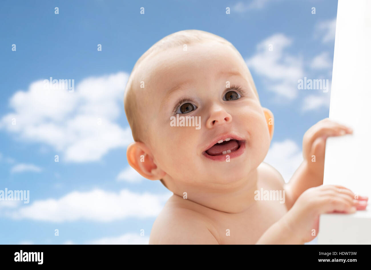 happy little baby boy or girl looking up Stock Photo - Alamy