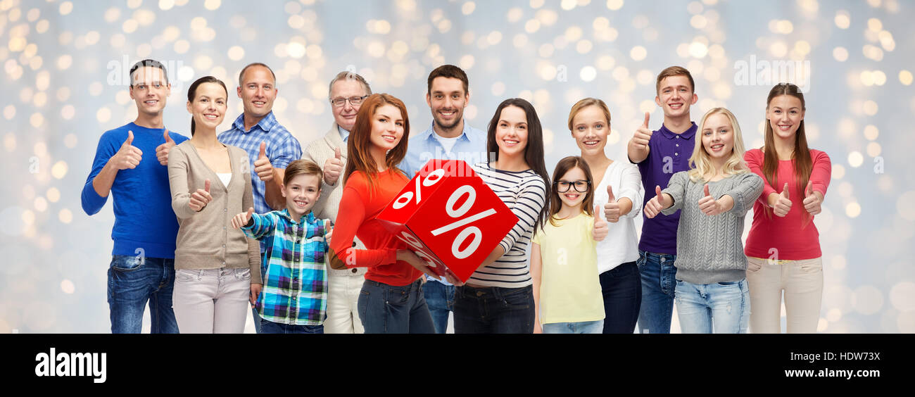 happy people with percent sign showing thumbs up Stock Photo - Alamy