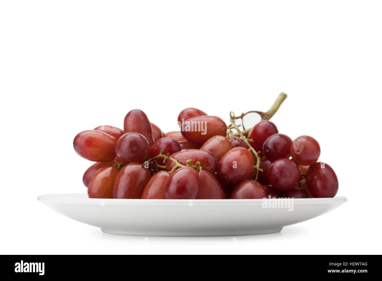 red seedless table grapes isolated on white background with clipping ...