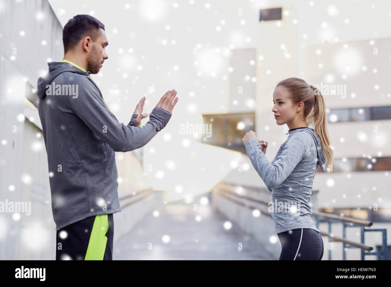 woman with coach working out strike outdoors Stock Photo - Alamy