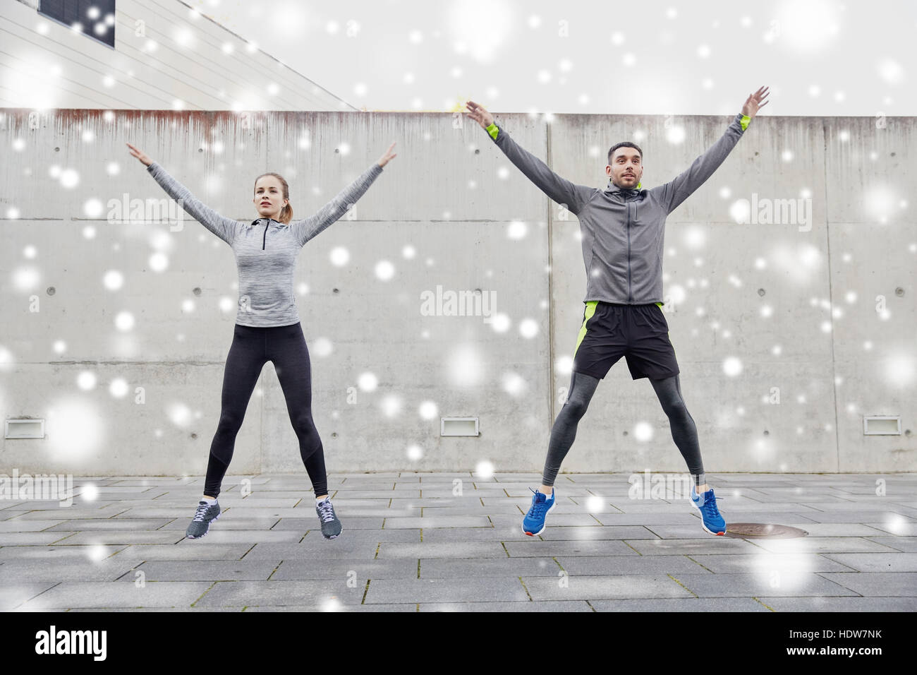 happy man and woman jumping outdoors Stock Photo - Alamy