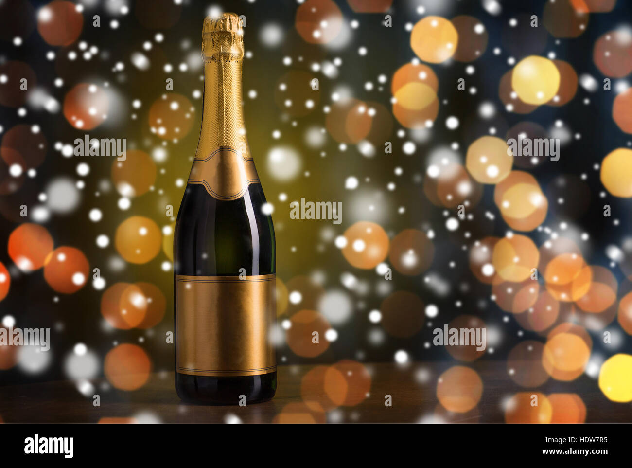 bottle of champagne with golden label over snow Stock Photo - Alamy