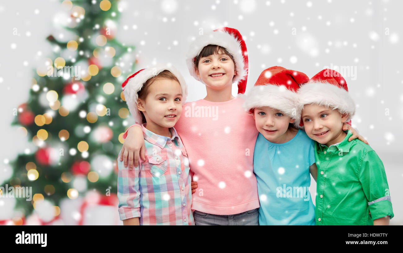 happy little children in christmas santa hats Stock Photo - Alamy