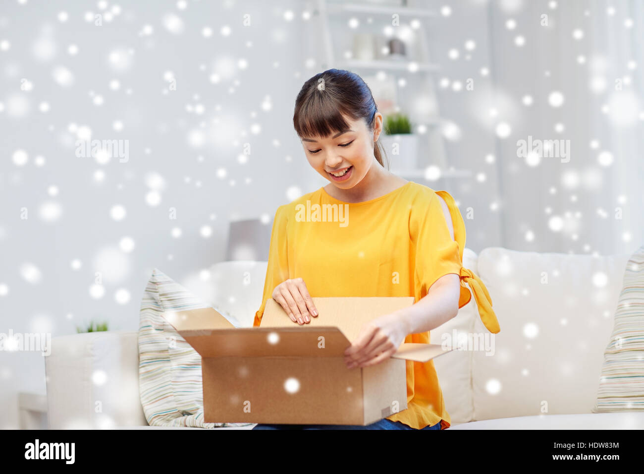 happy asian young woman with parcel box at home Stock Photo - Alamy