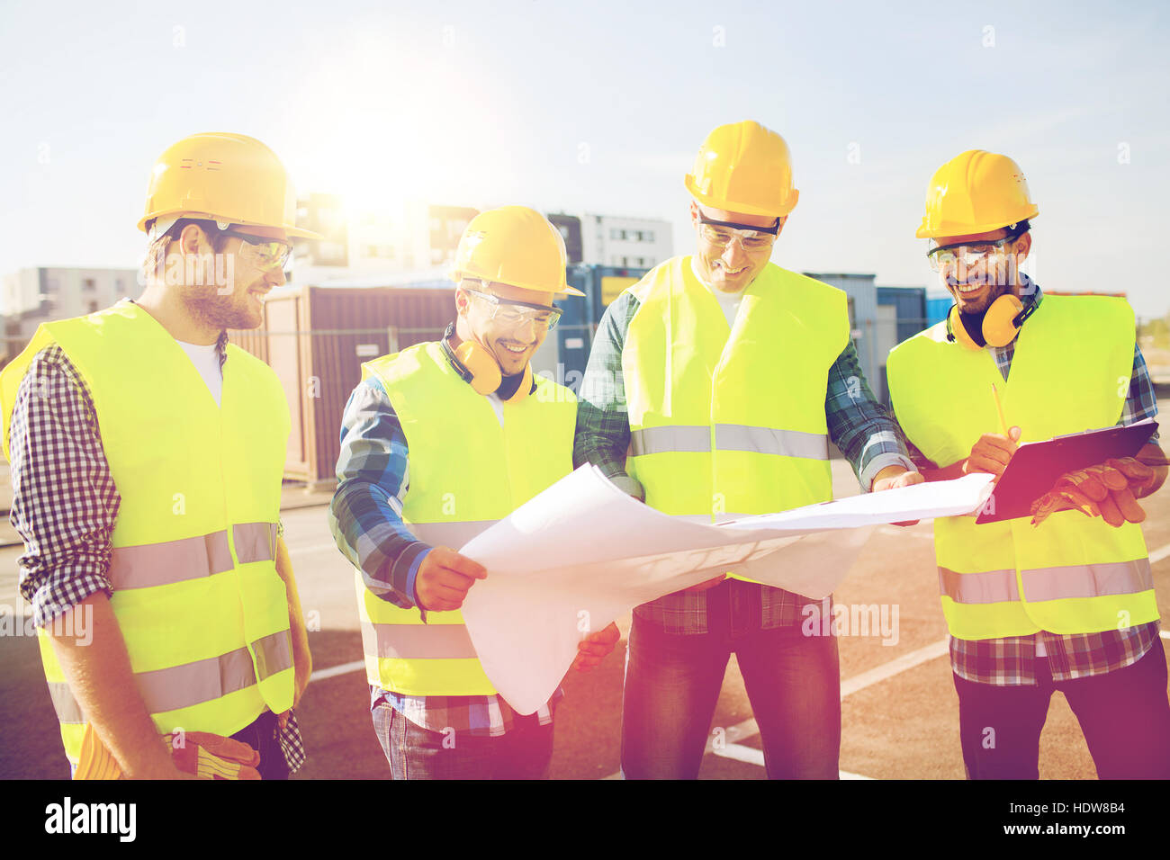 group of builders with tablet pc and blueprint Stock Photo - Alamy