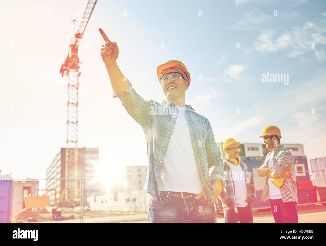 builders pointing finger aside on construction Stock Photo - Alamy