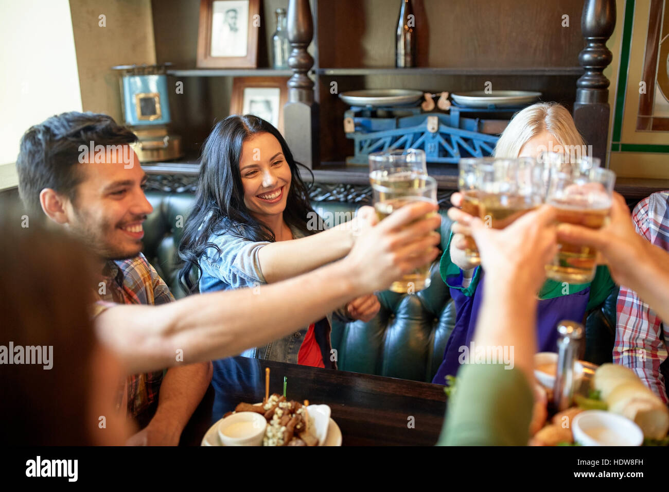 happy friends drinking beer at bar or pub Stock Photo - Alamy
