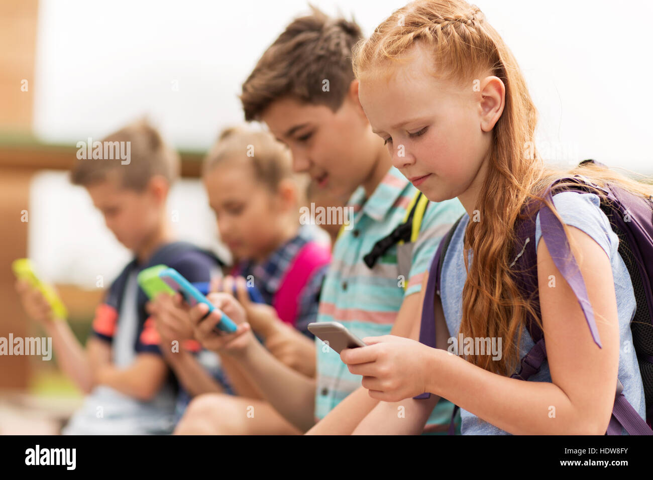 elementary school students with smartphones Stock Photo - Alamy