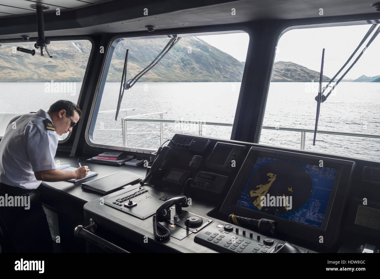 Captain on bridge of cruise ship in Tierra del Fuego, Patagonia; Chile ...