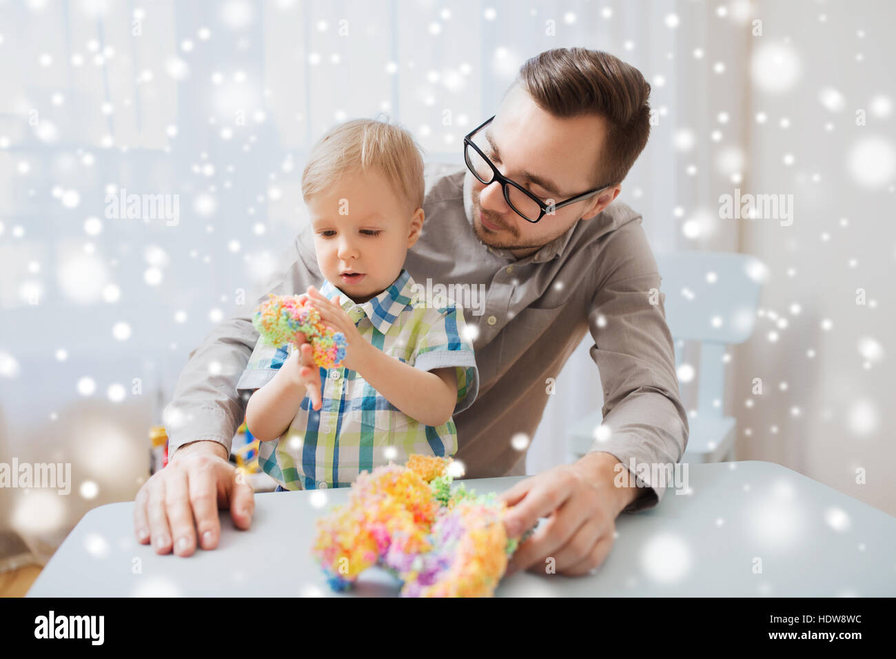 father and son playing with ball clay at home Stock Photo - Alamy