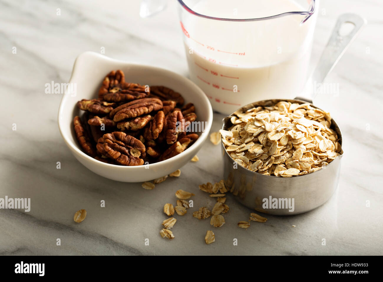 Cooking oatmeal with oats and milk Stock Photo - Alamy