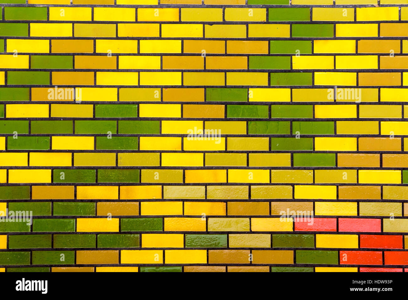 Close up of abstract red green and yellow painted rectangular pattern ...